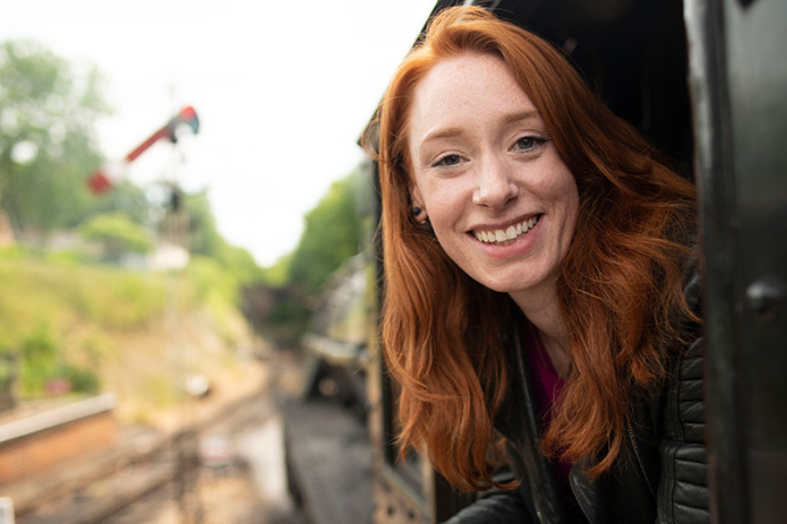 Hannah Fry on a train